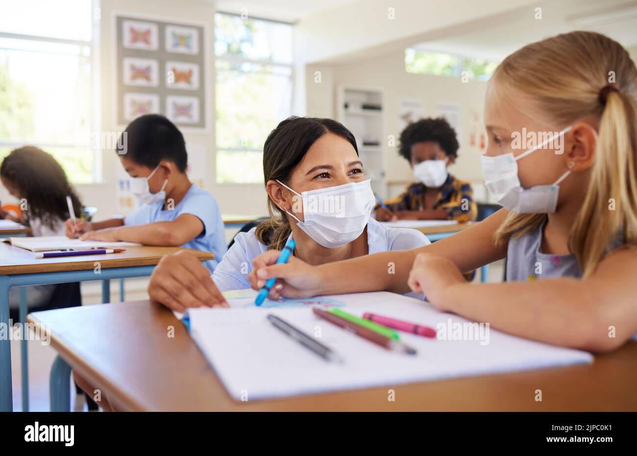 Covid, education and learning with a teacher helping a student during ...