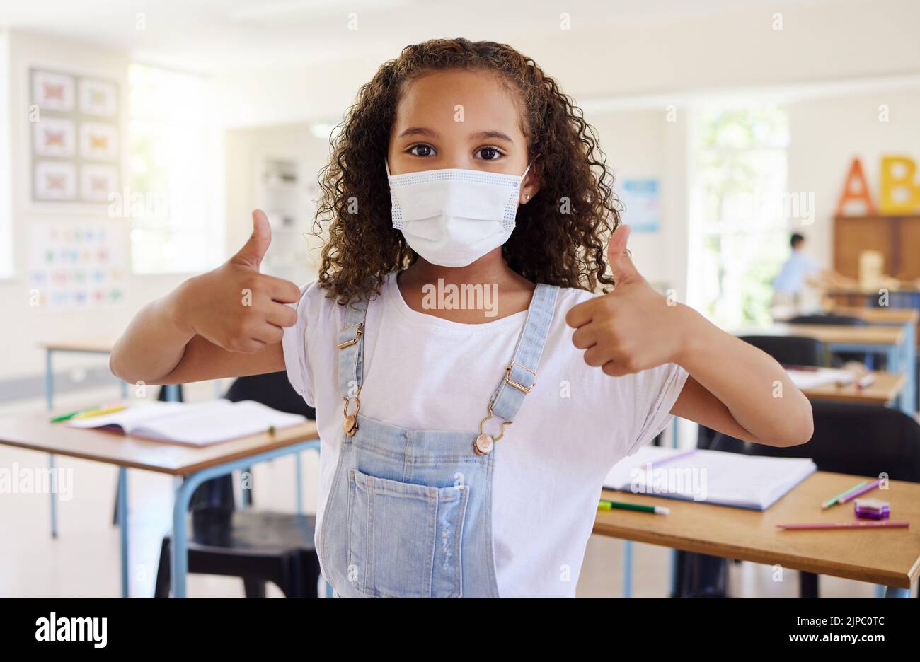 Thumbs up for education with covid, school student pleased with ...