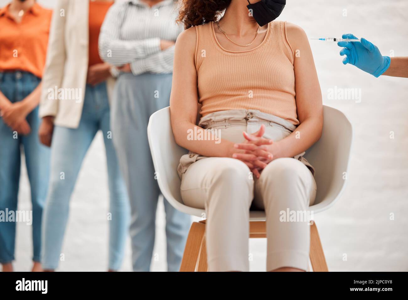 Covid vaccine, shot or jab with a female patient getting an injection ...
