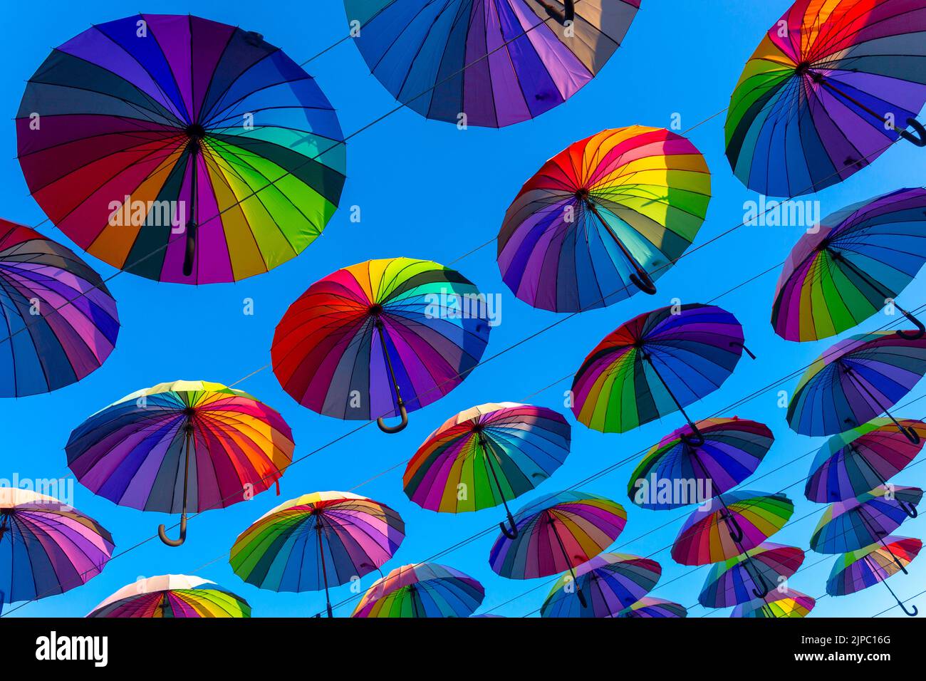Many colorful and vivid umbrellas hi-res stock photography and images ...