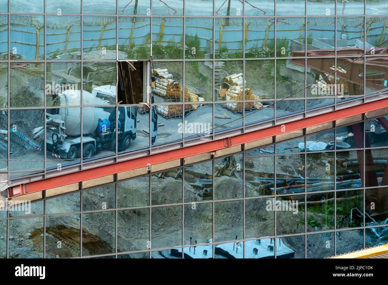 industrial background - a mirror wall of an unfinished building, which ...