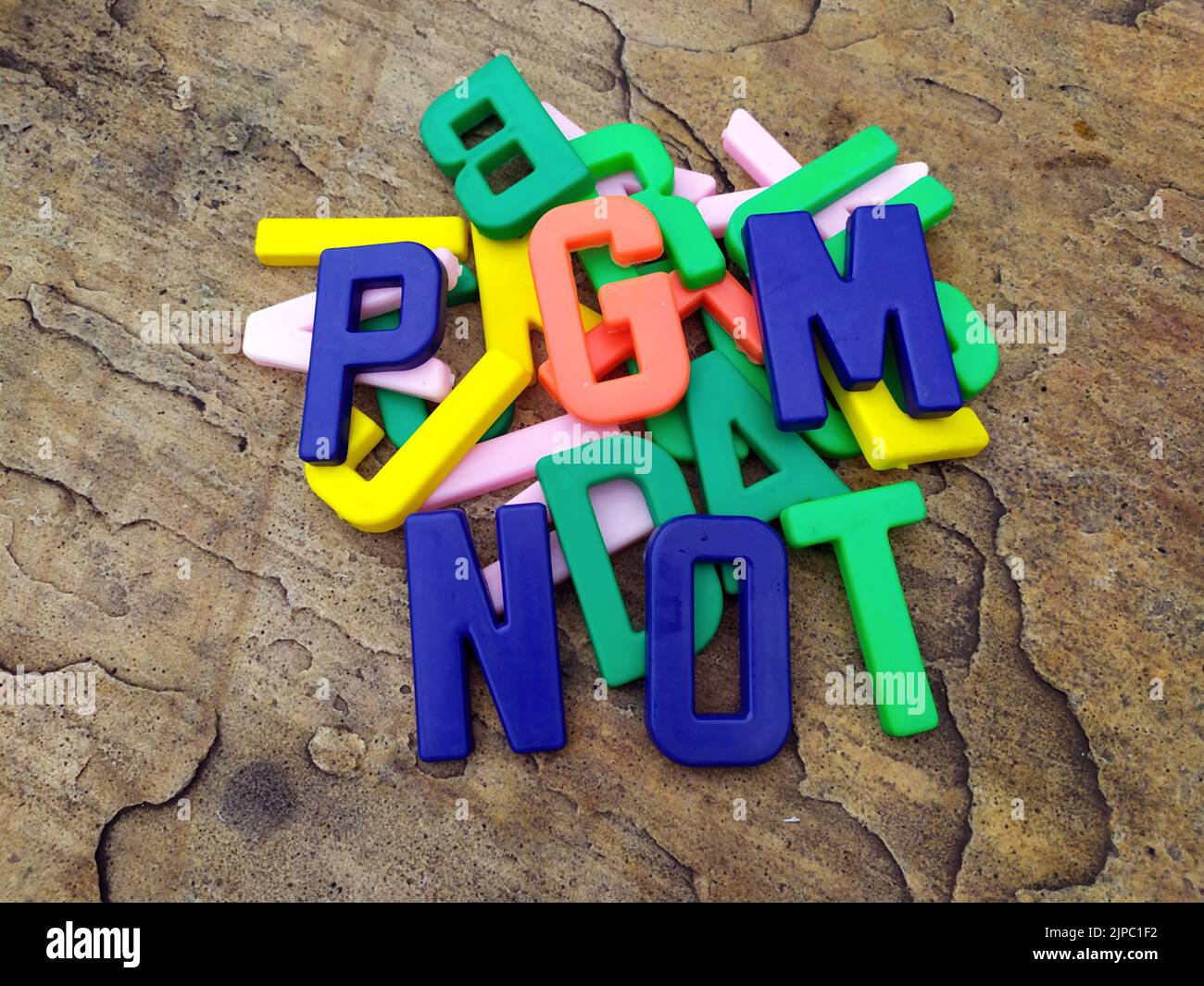 Multi color alphabet letter isolated on stone background Stock Photo ...