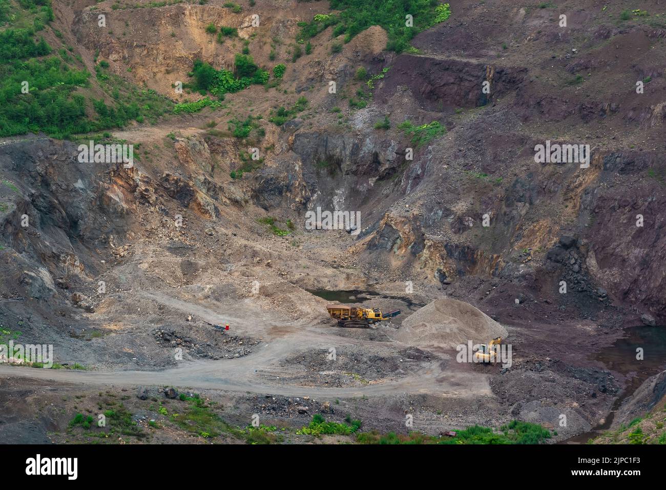 small quarry with mining machinery in mountainous area Stock Photo - Alamy