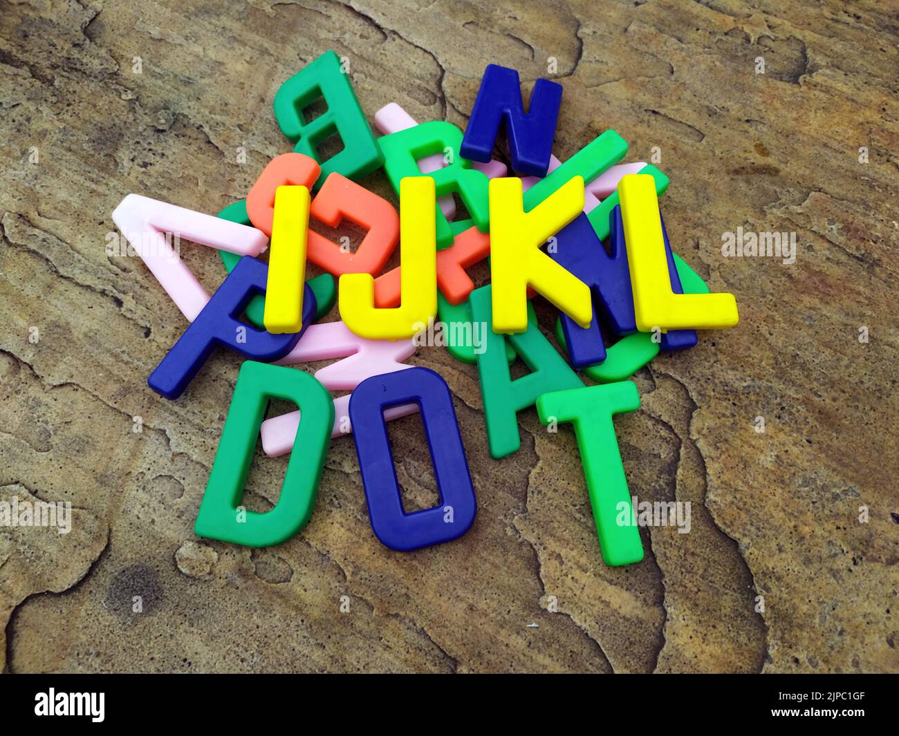 Multi color alphabet letter isolated on stone background Stock Photo ...