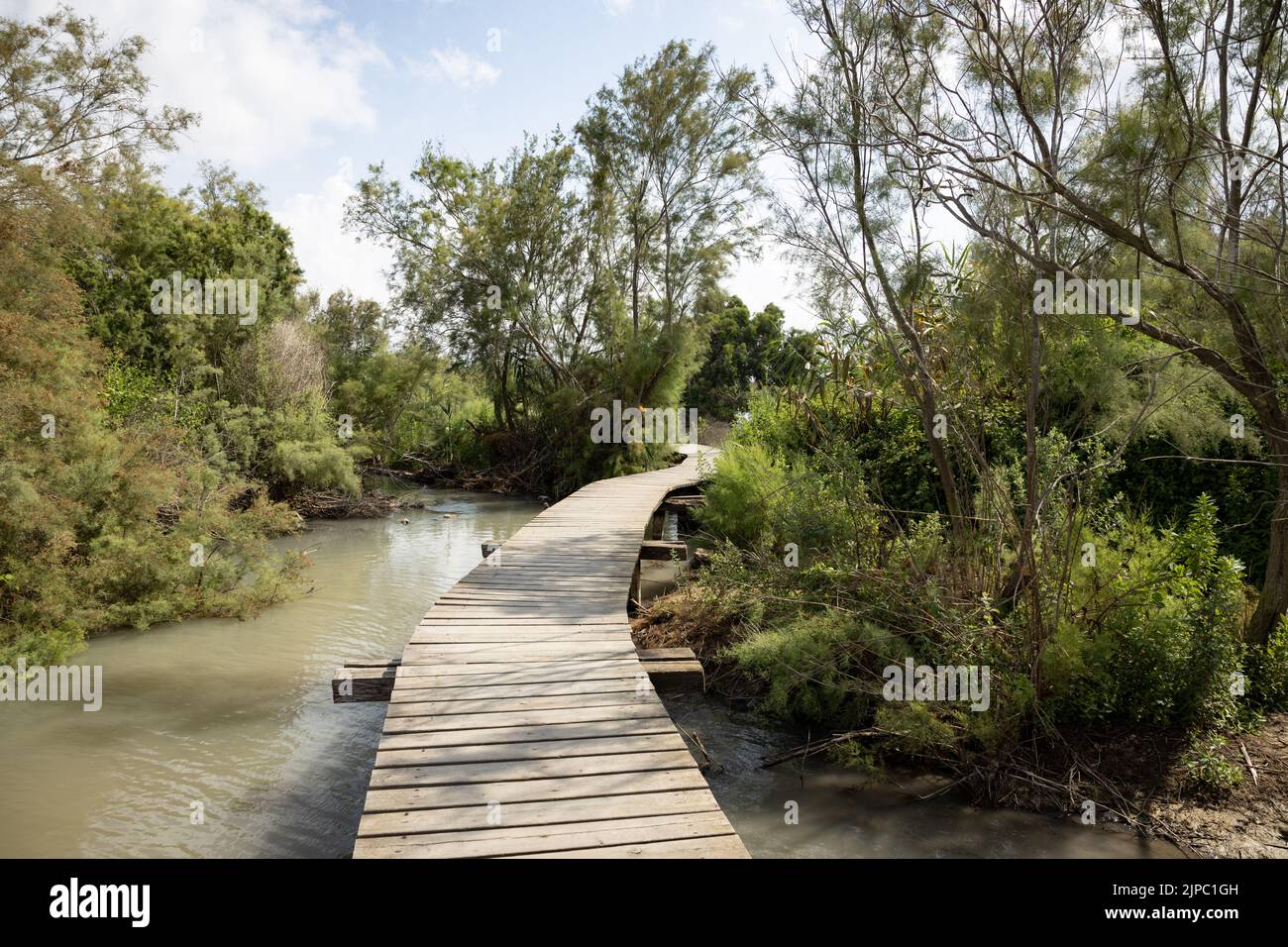 A wooden footbridge crossing the water, Ein Afek nature reserve, Israel ...