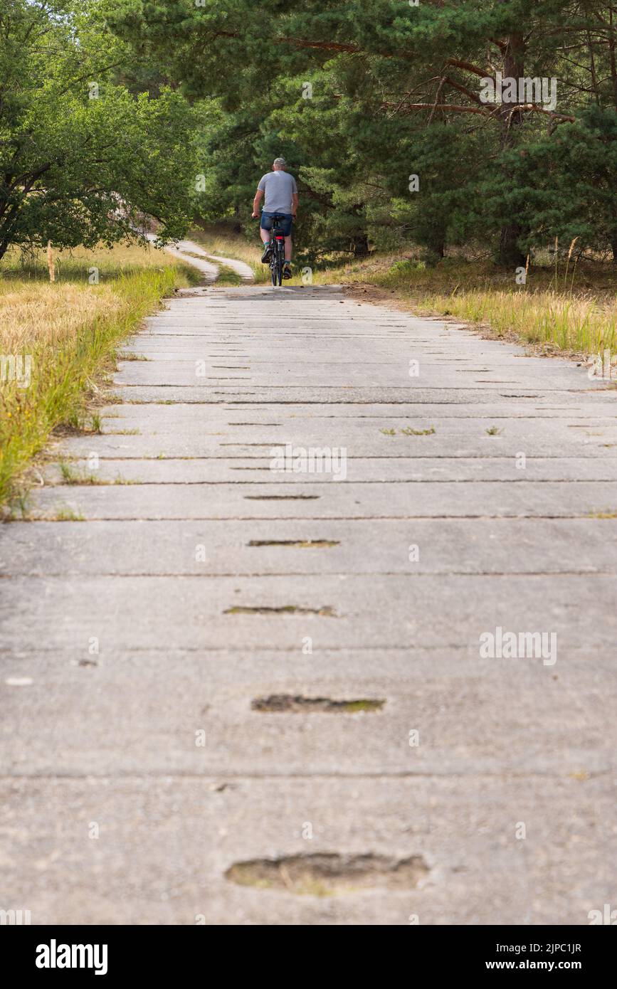 Tourist cycling along the green belt near Domitz former inner-German ...