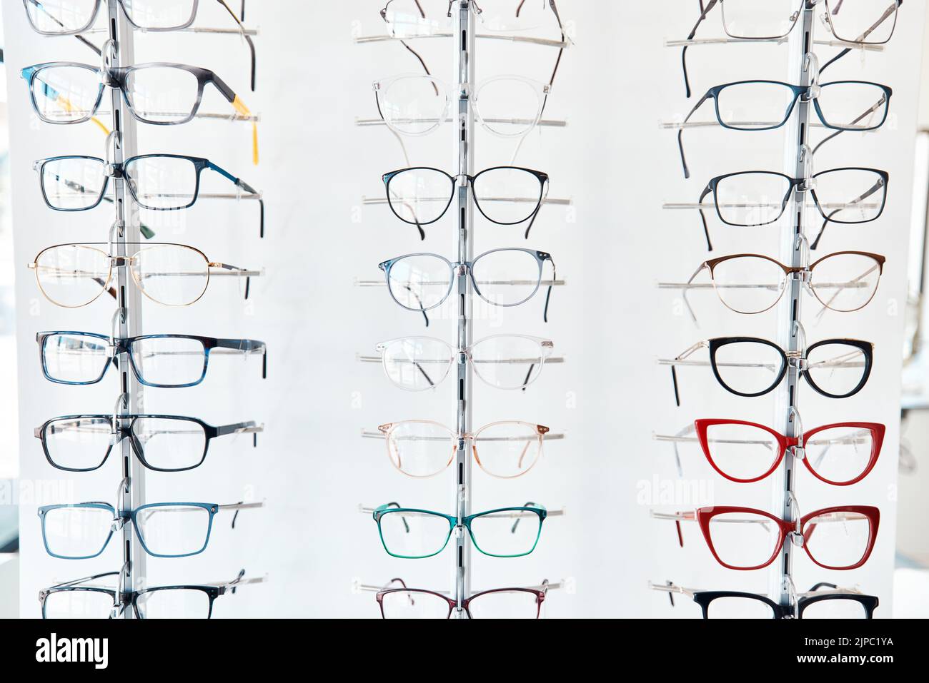 Glasses, optometrist and shelf with new, trendy and colorful spectacles ...