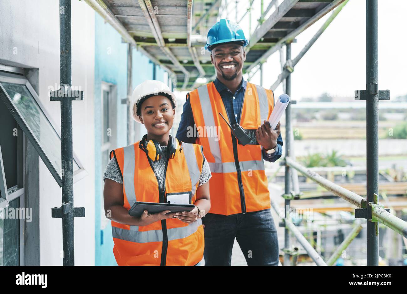 Builder and engineer working together as a construction team on a ...
