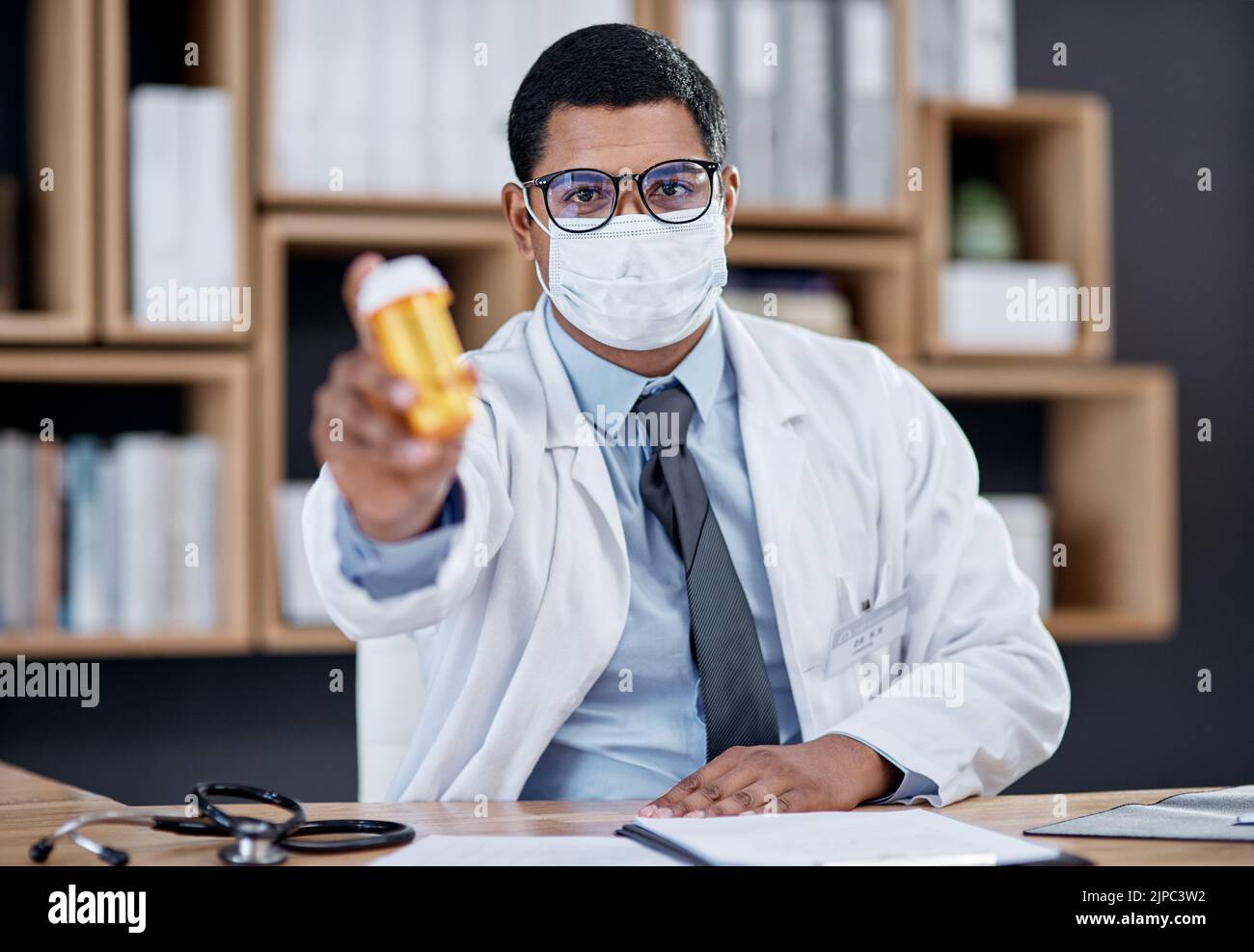 Doctor selling medicine for covid at medical consultation, sitting ...