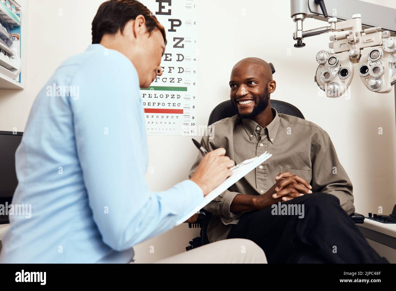 Eye test, exam or screening with an optometrist, optician or ...