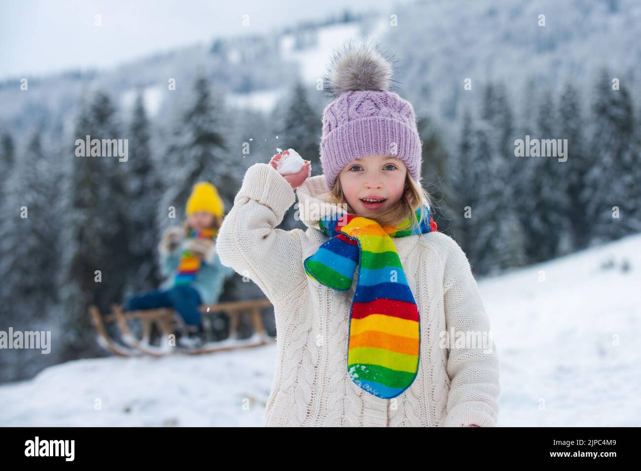 Happy kids playing snowball fight hi-res stock photography and images ...