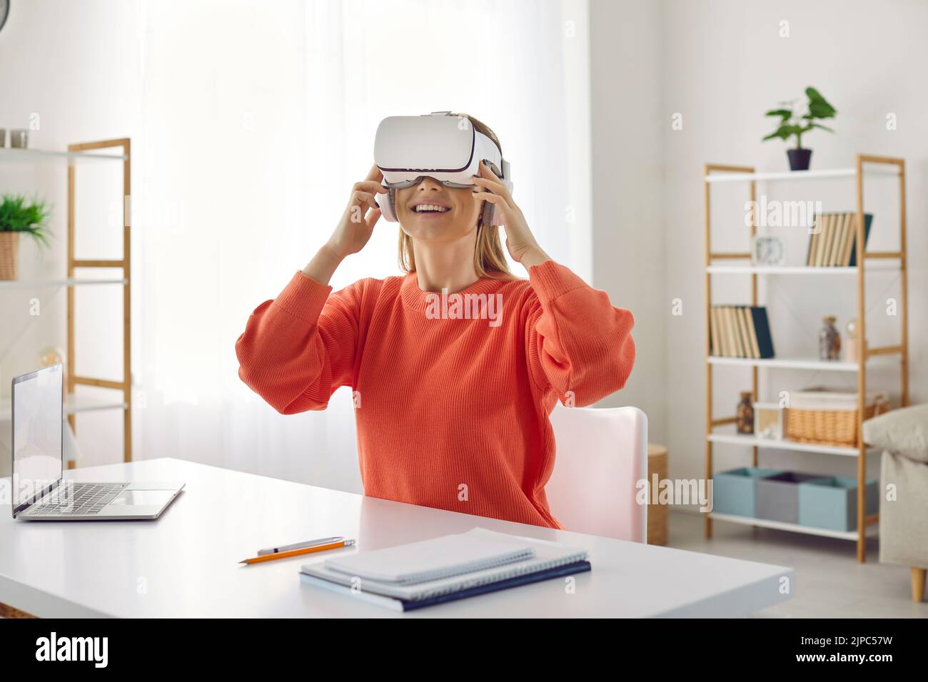 Student is happy to use innovative virtual reality glasses during her ...