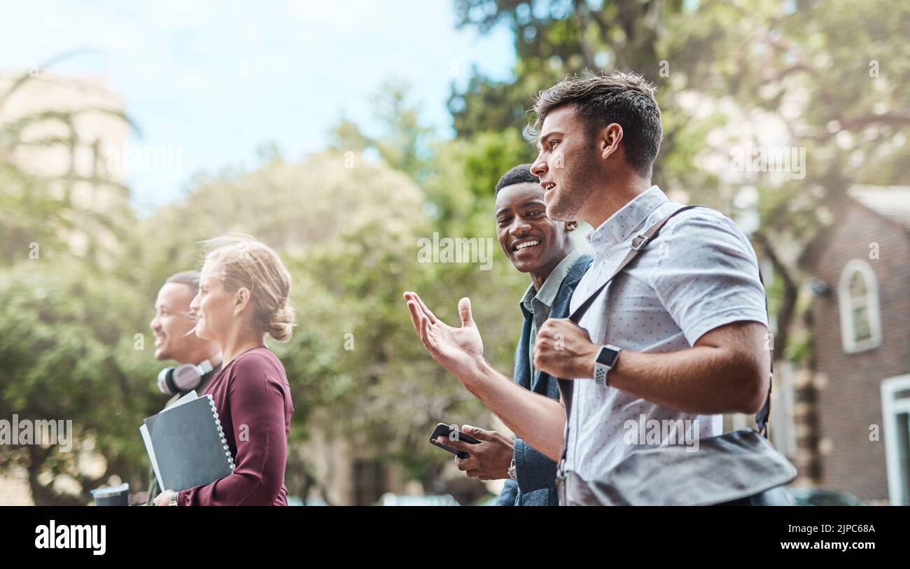 Students, creative team and conversation outside while walking and ...