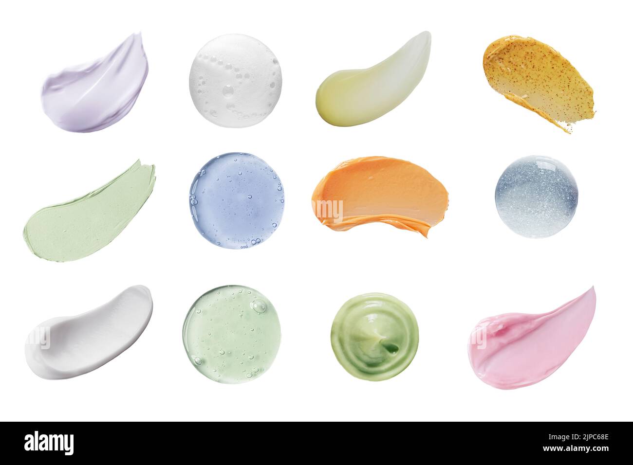 Smears of different colors cosmetic products isolated on a white ...