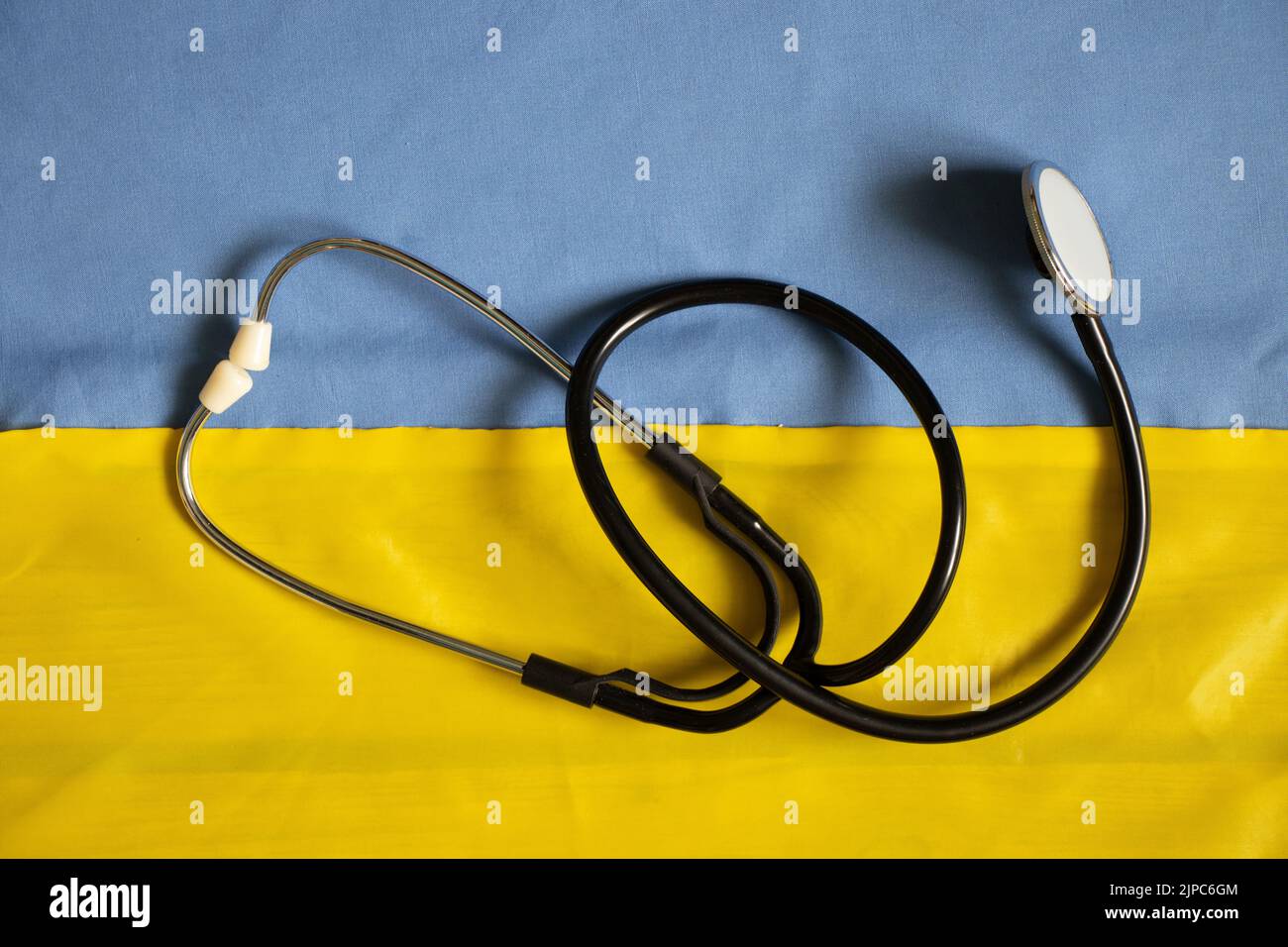 The stethoscope lies on the national flag of Ukraine yellow blue ...