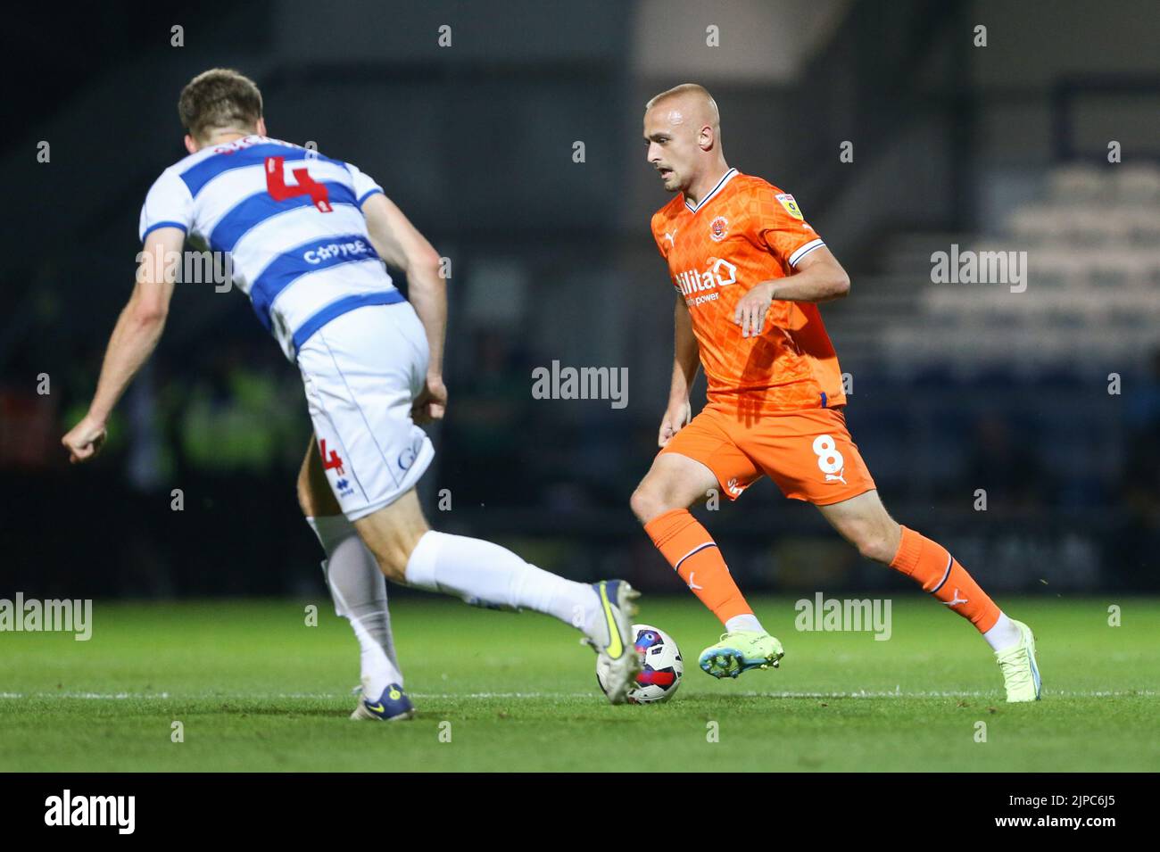 Lewis Fiorini #8 of Blackpool runs at Rob Dickie #4 of QPR Stock Photo ...