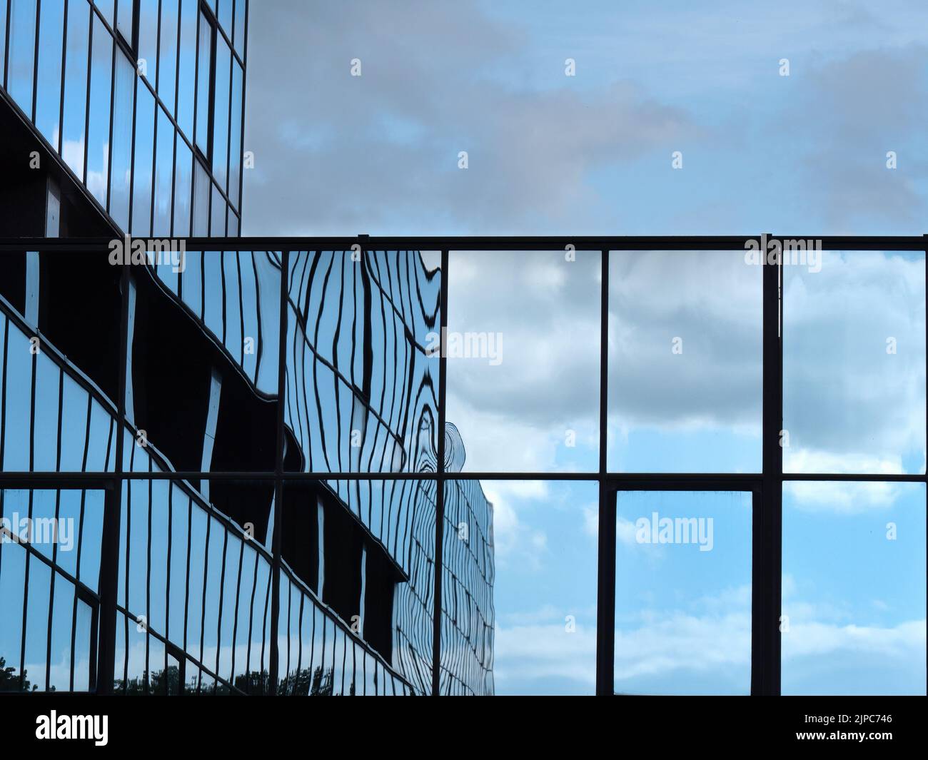 Blue Sky and Clouds Reflected in the Glass Building Stock Photo - Alamy