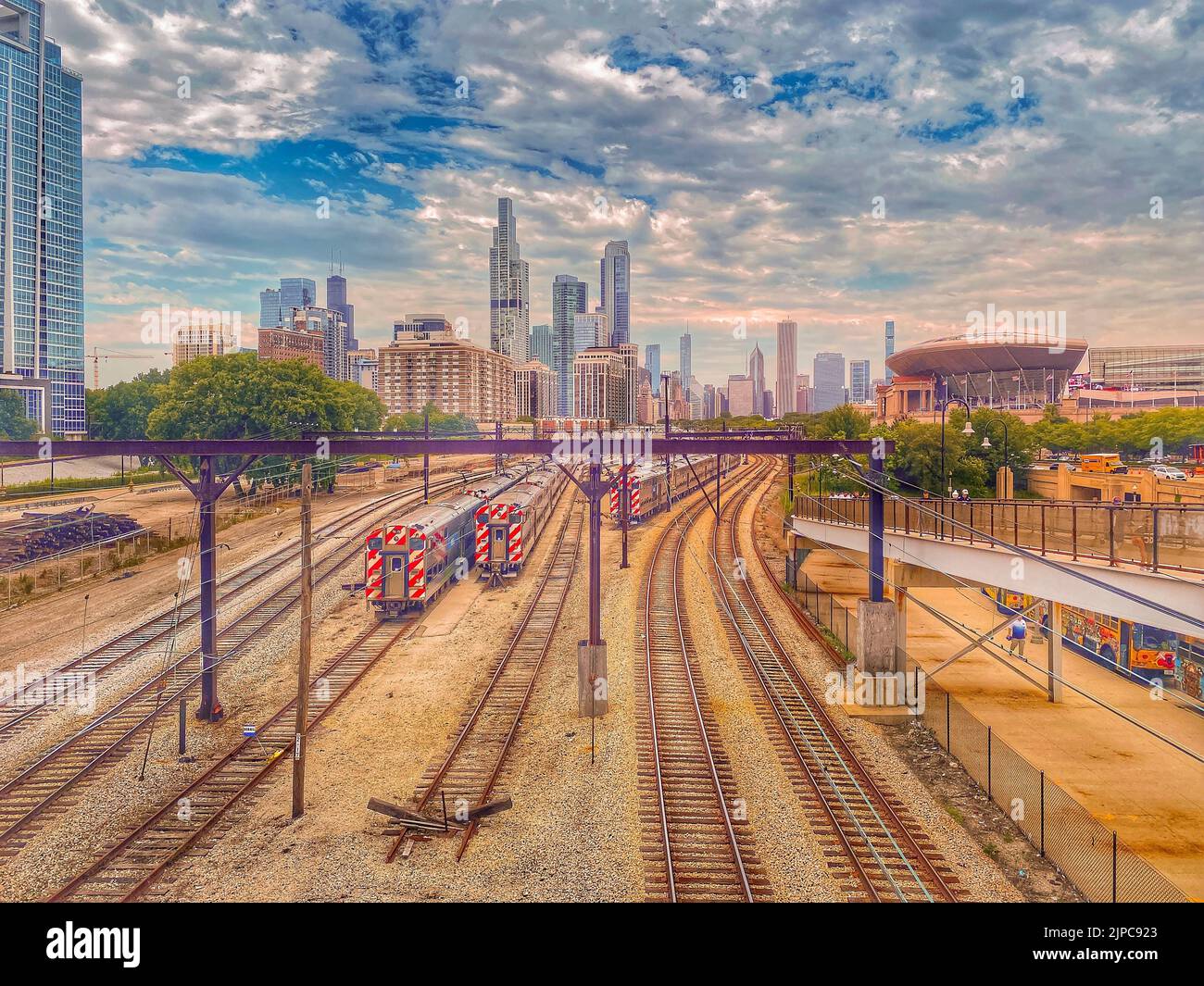 View of downtown Chicago from above train tracks with trains on a ...