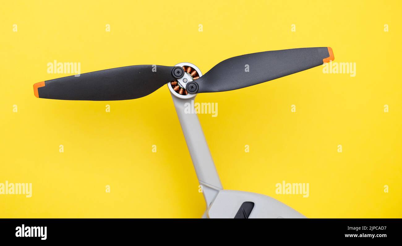 A top view of drone Propellers of a quadcopter isolated on the yellow ...