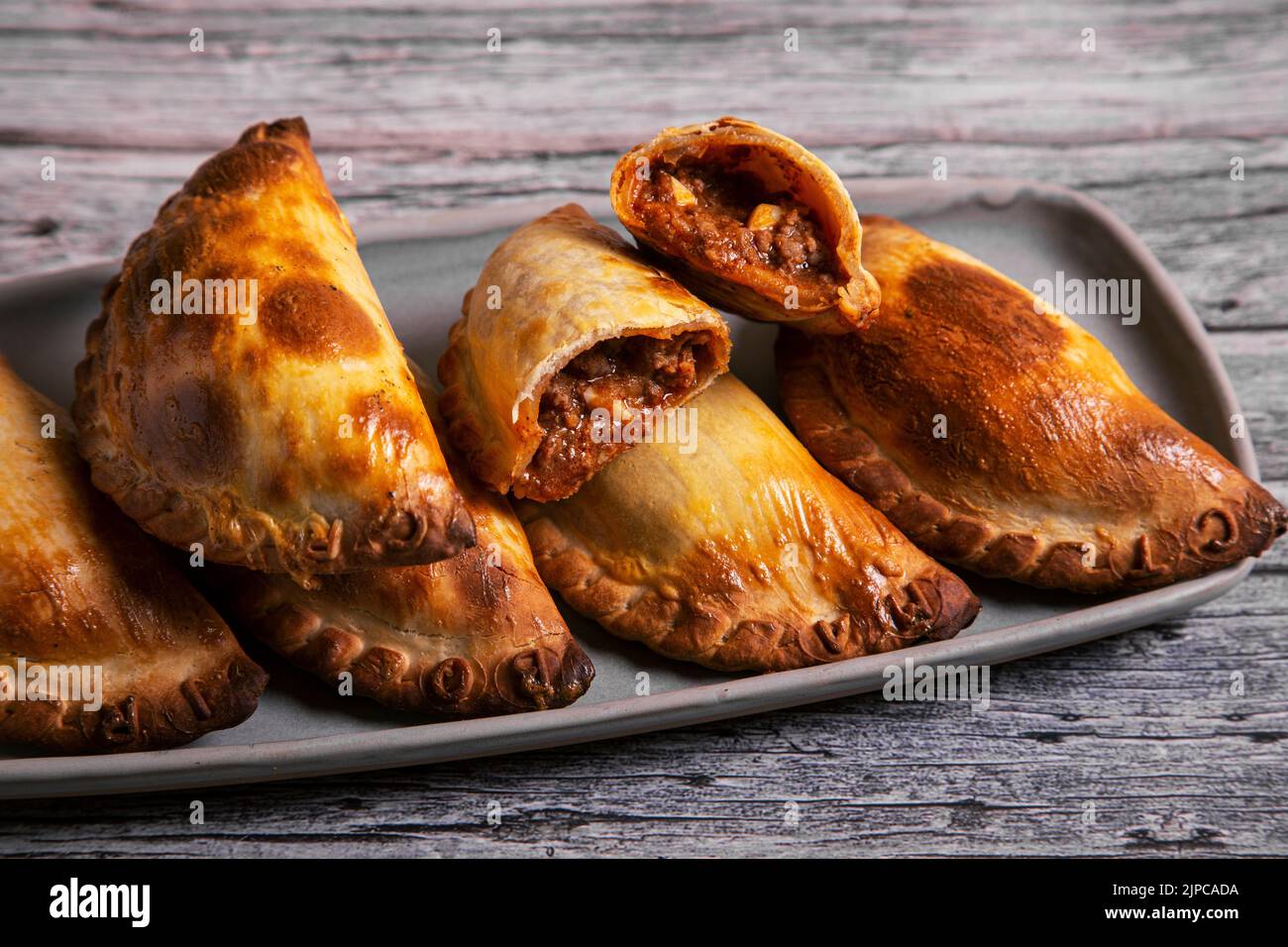 A closeup shot of traditional Argentinian and Uruguayan empanadas on ...