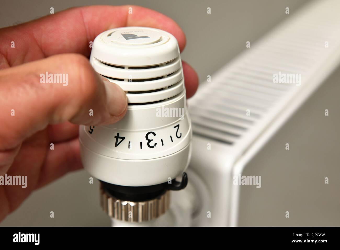 Illustration photo - a thermostat on a modern heating system in an ...