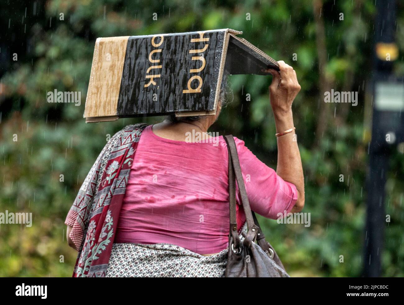 Makeshift rain cover Wet weather finally in London after rough ...