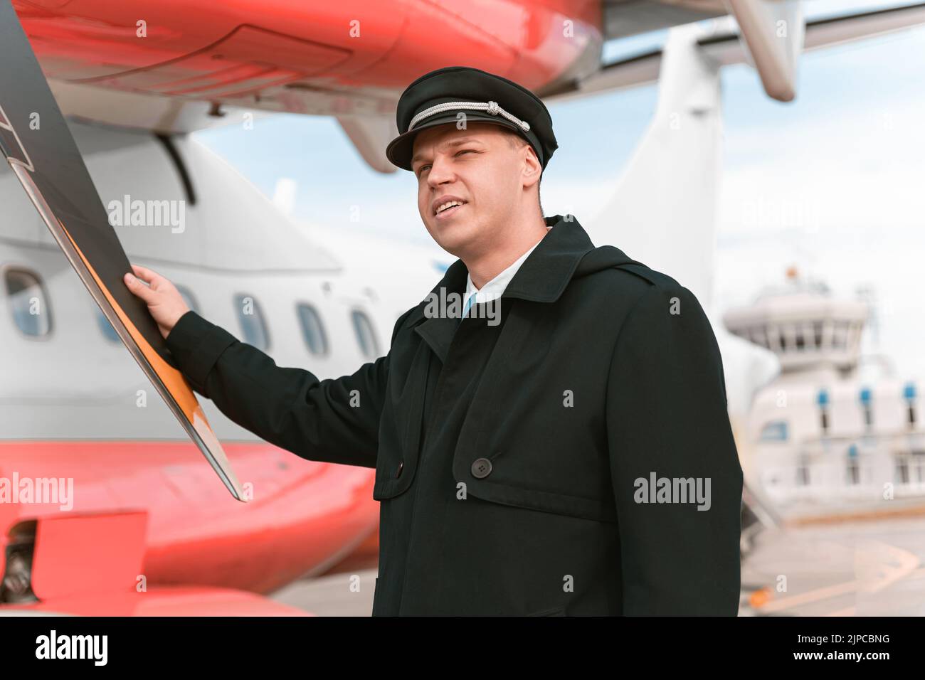 Professional Airline pilot in uniform standing near aircraft Stock ...