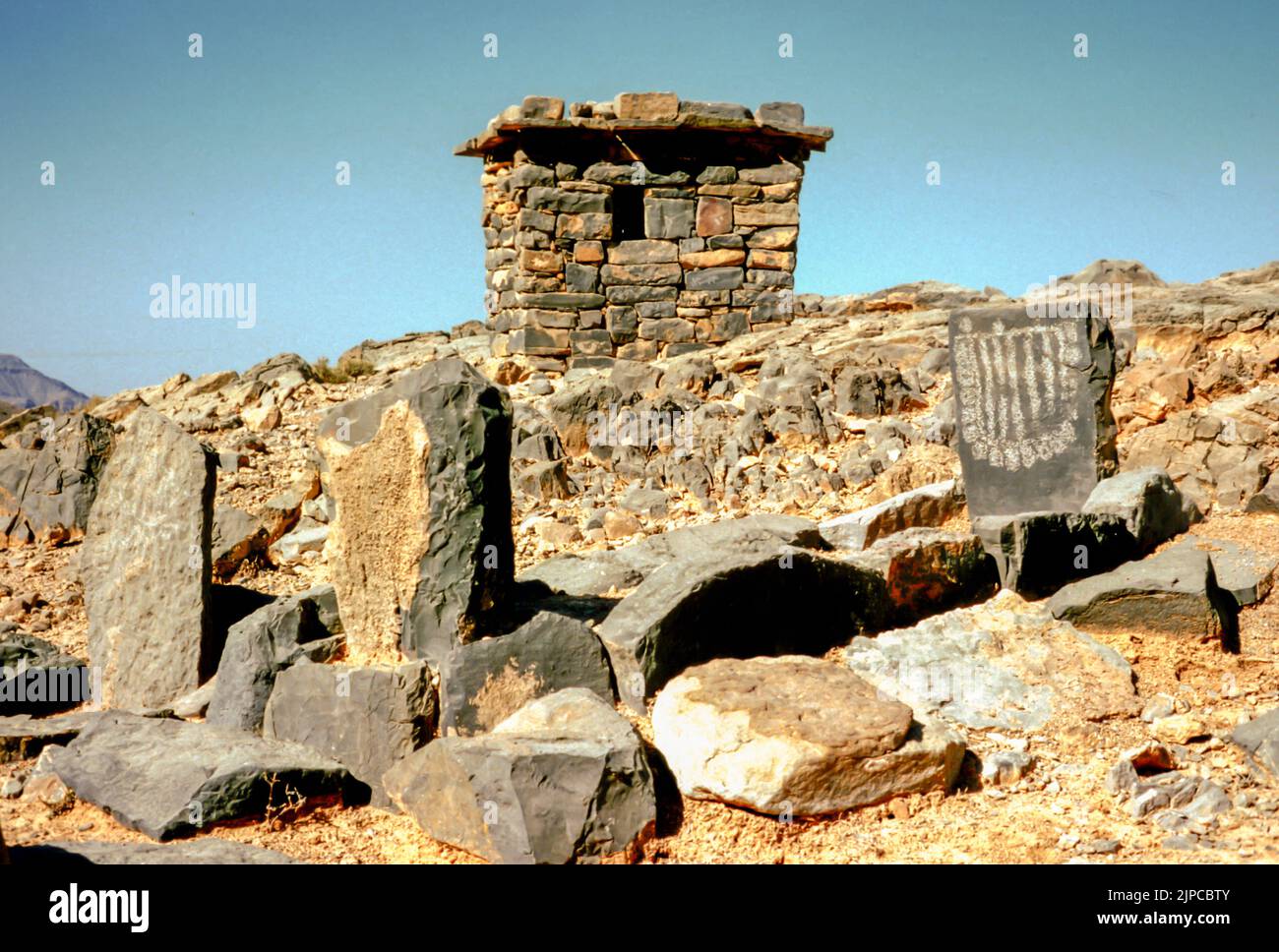 Stone tower and petroglyph-etched gravestones remain in an abandoned ...