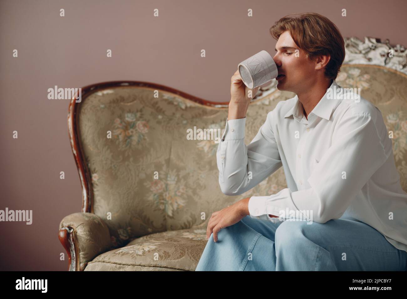 Handsome man enjoying drinking tea hi-res stock photography and images ...