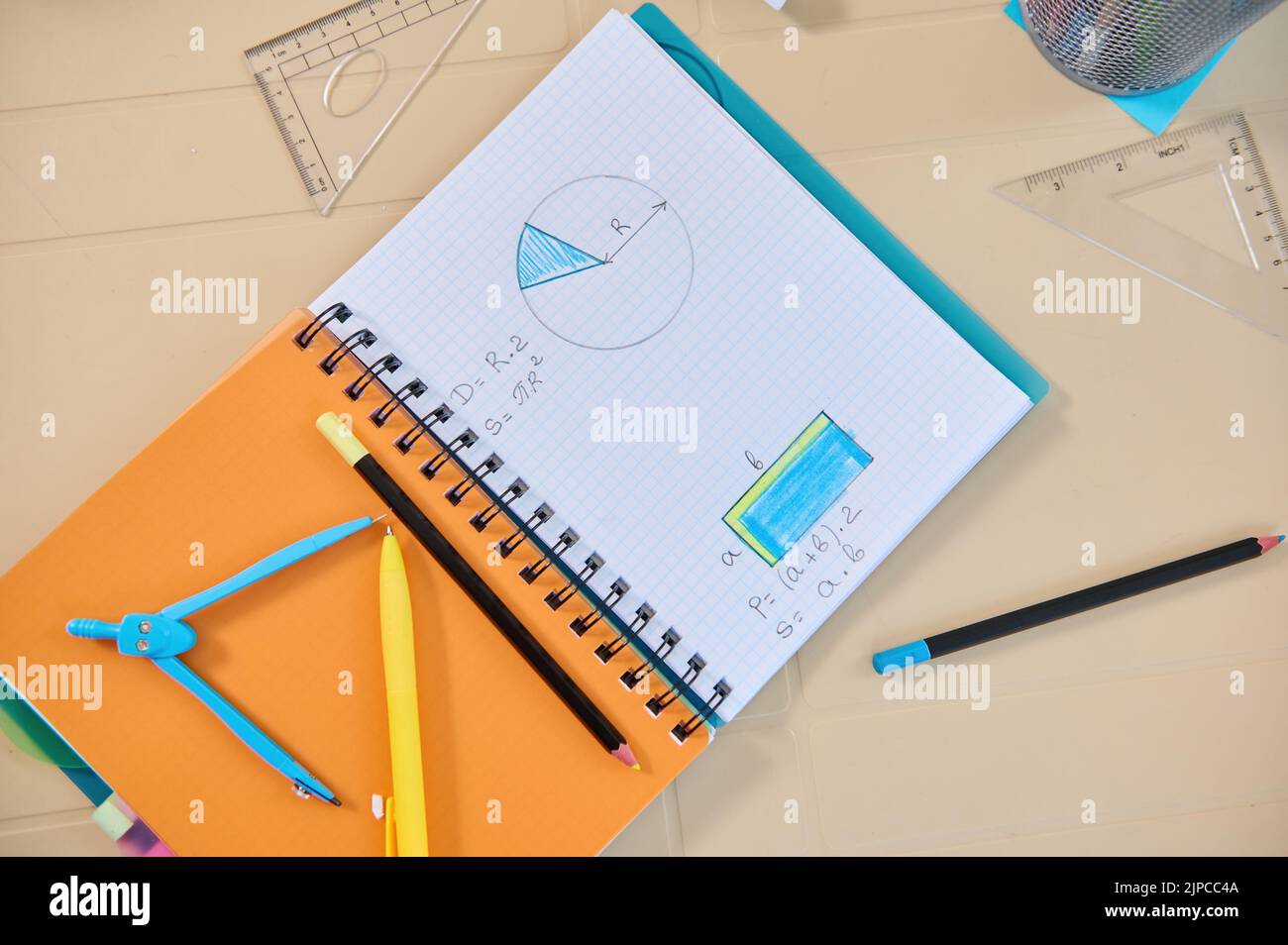 Top view of a copybook with geometry examples for solving in primary ...