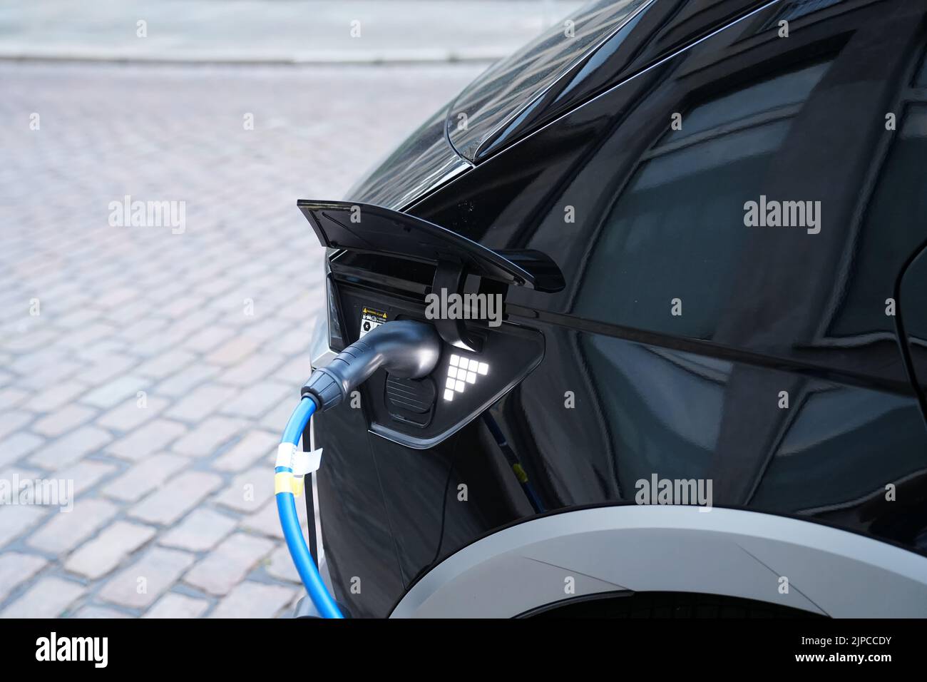 Electromobile charging plug is inserted into vehicle charging socket ...