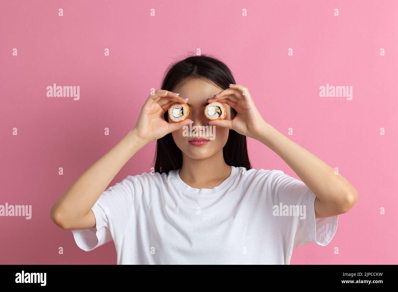 Asian beauty model girl eating Sushi roll, healthy japanese food ...