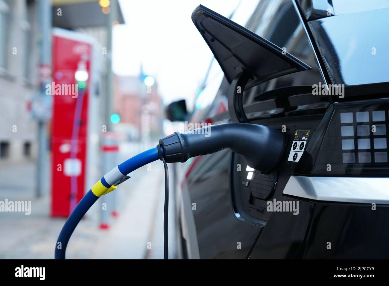 Electromobile charging plug is inserted into vehicle charging socket ...