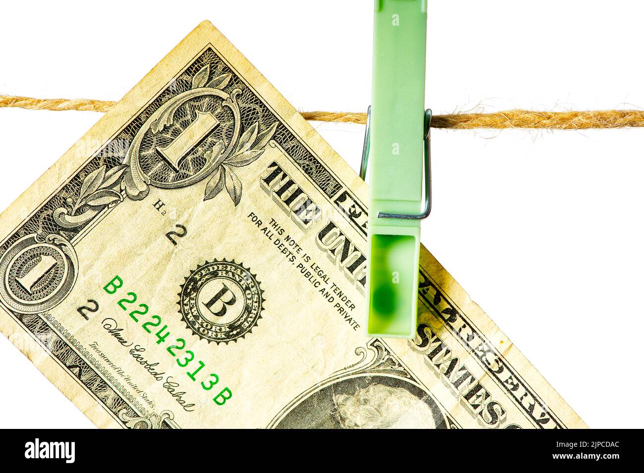 Money laundering. Dollar banknotes hanging on clothesline isolated on ...