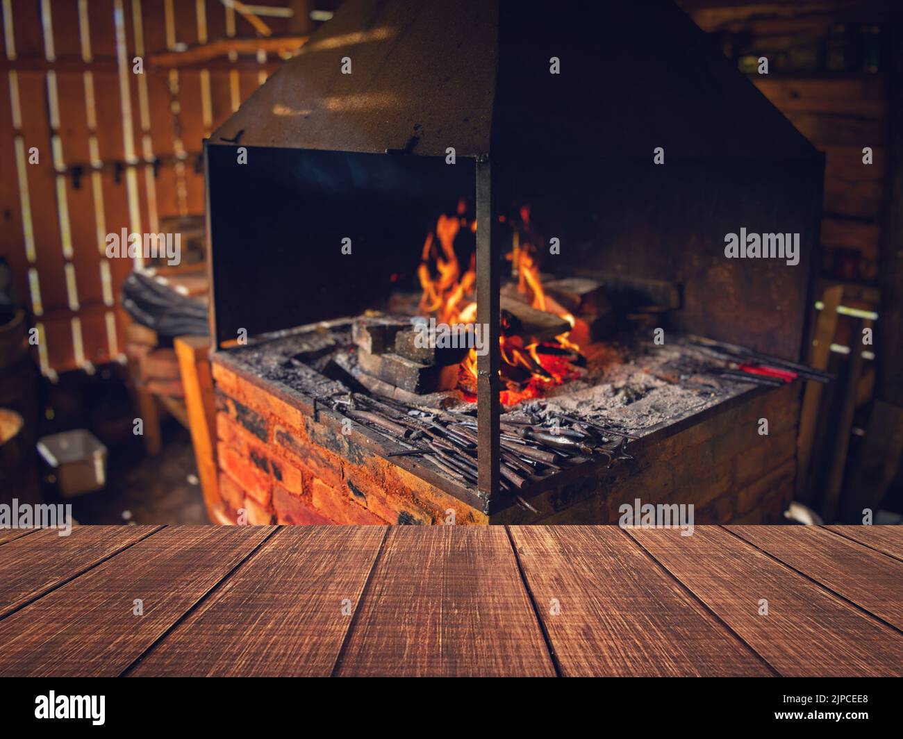 Interior of an old forge. Bright fire burning in the furnace. Forge ...