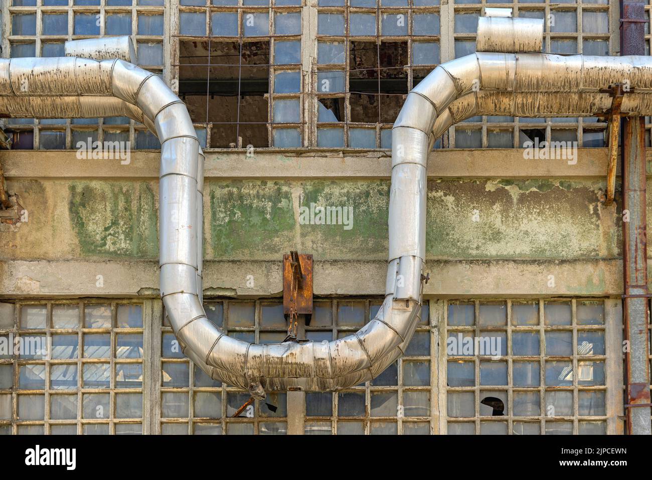U Shape Bend at Steam Pipe Line in Old Factory Stock Photo - Alamy