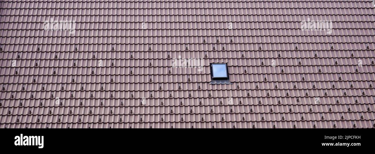 A view of a tiny window on a tiled roof Stock Photo - Alamy
