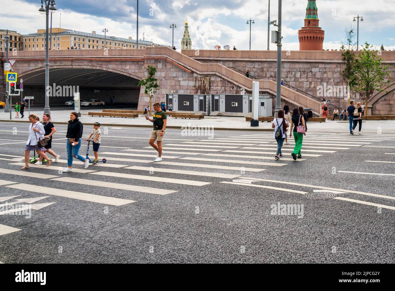 MOSCOW, RUSSIA, 17 JULY, 2022 : People crossing the asphalt road at the ...