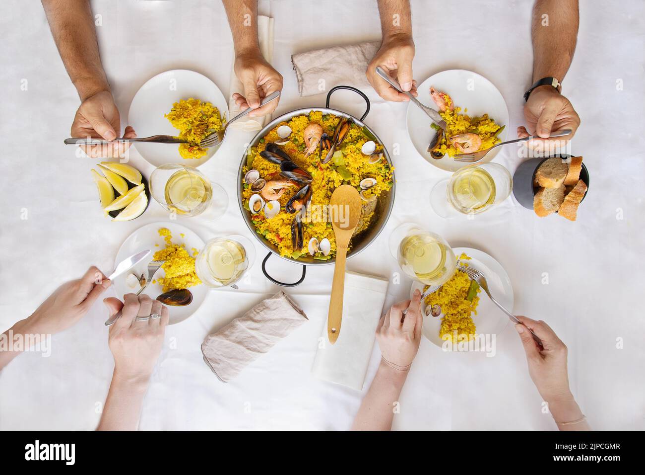 Friends eating together paella hi-res stock photography and images - Alamy
