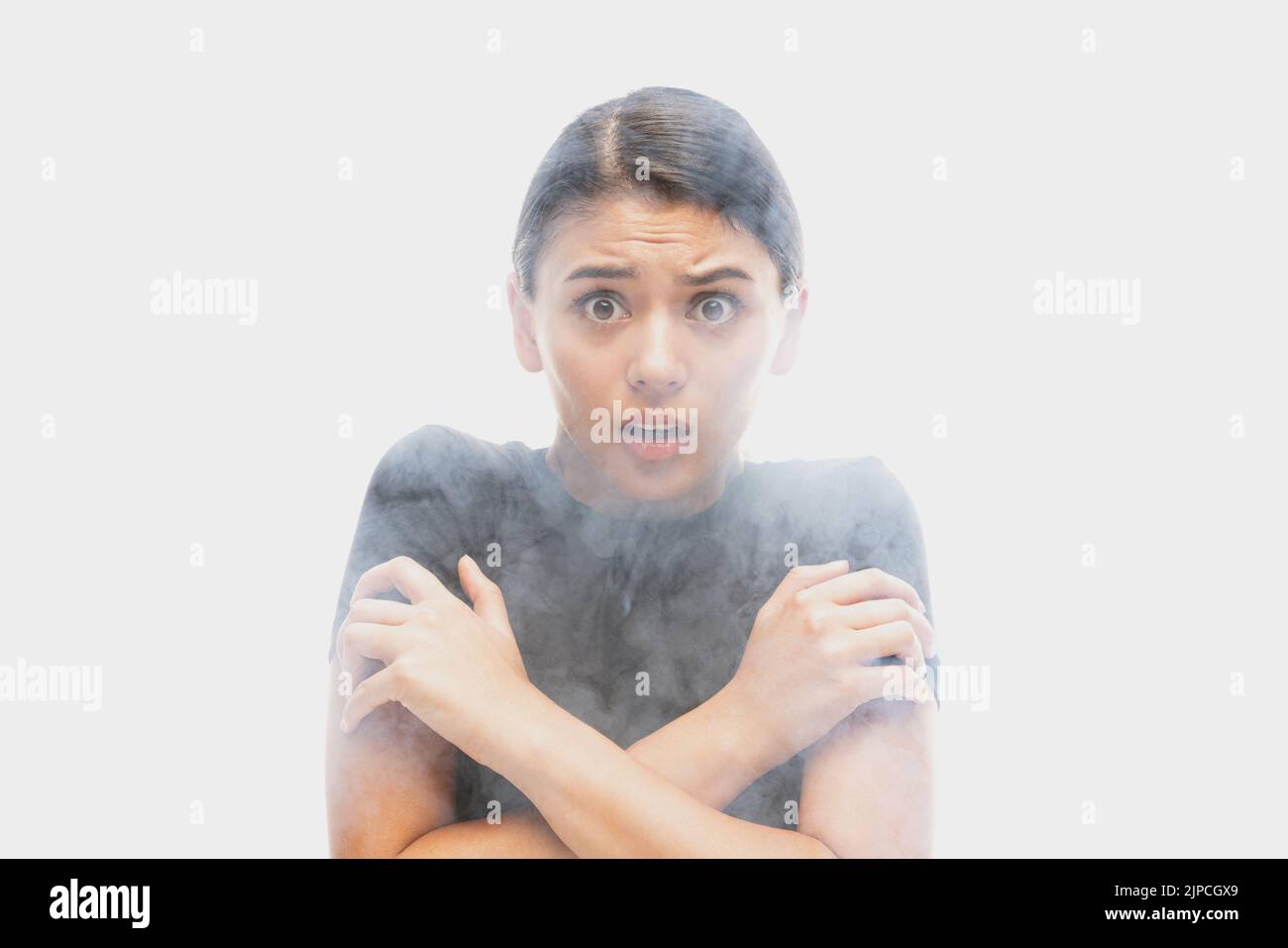 Shocked young dark hair woman looking at camera with wide open eyes ... Shocked young dark hair woman looking at camera with wide open eyes ...