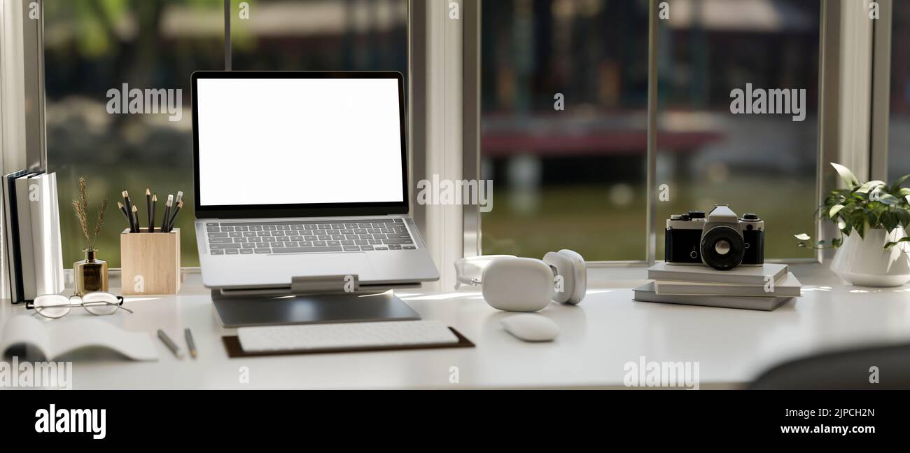 Modern creative office desk workspace with notebook laptop white screen ...