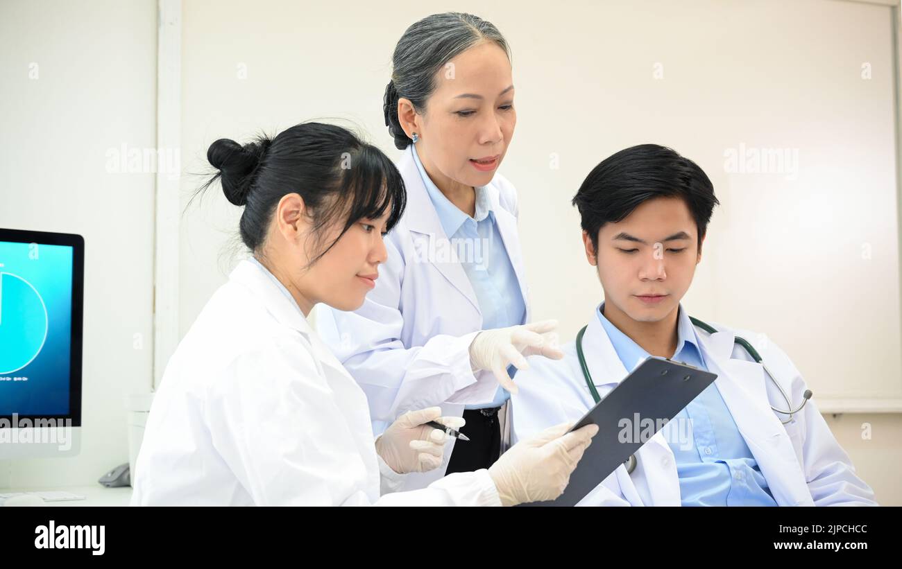 A team of professional Asian scientist discussing and brainstorming on ...