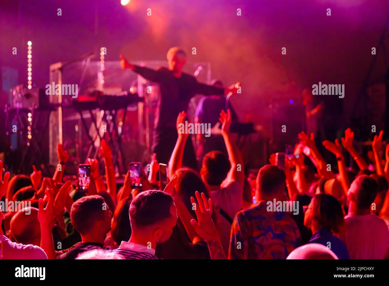 Crowd dancing near stage during concert Stock Photo - Alamy