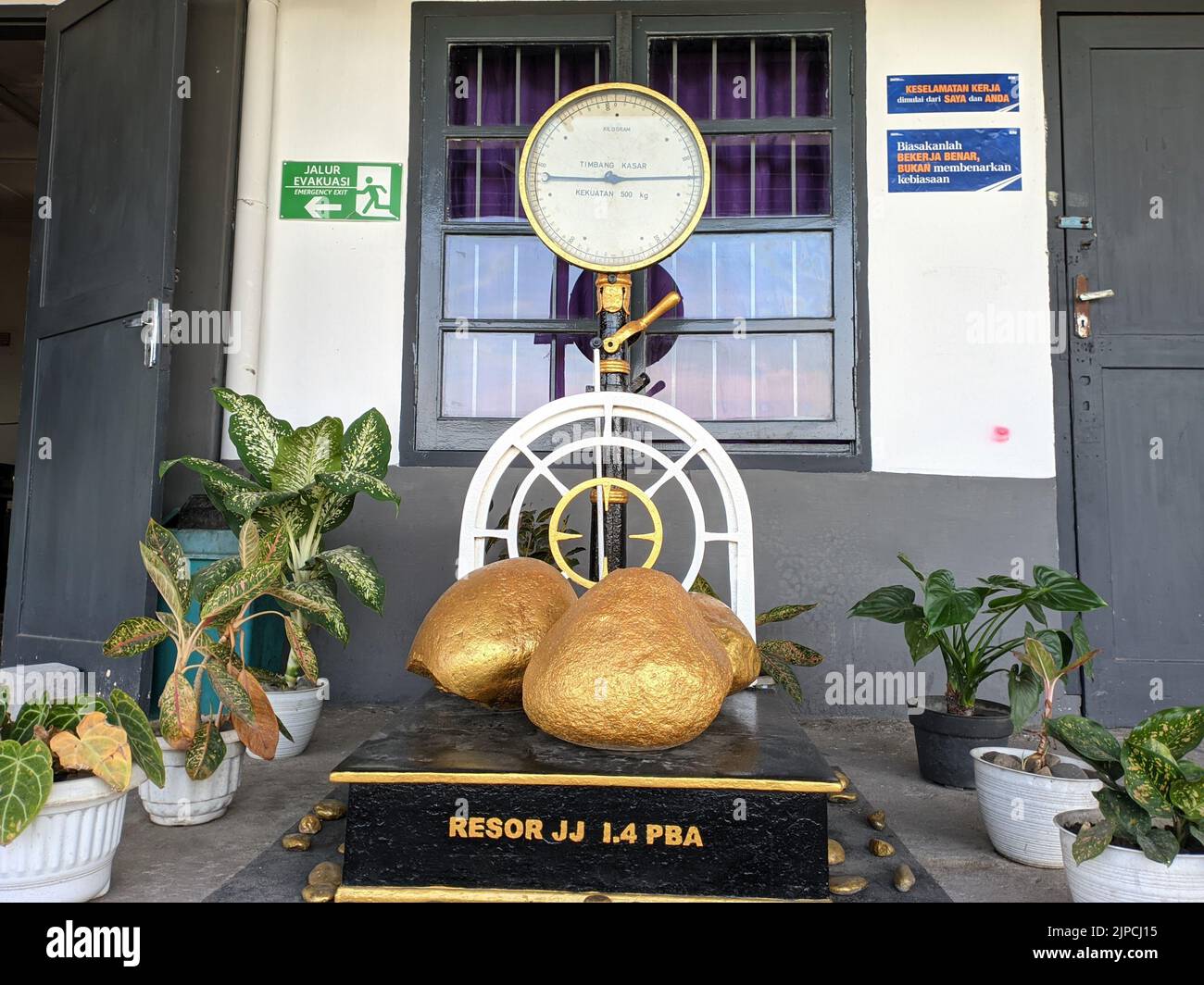 A resort monument surrounded by plant in front of building in Medan ...