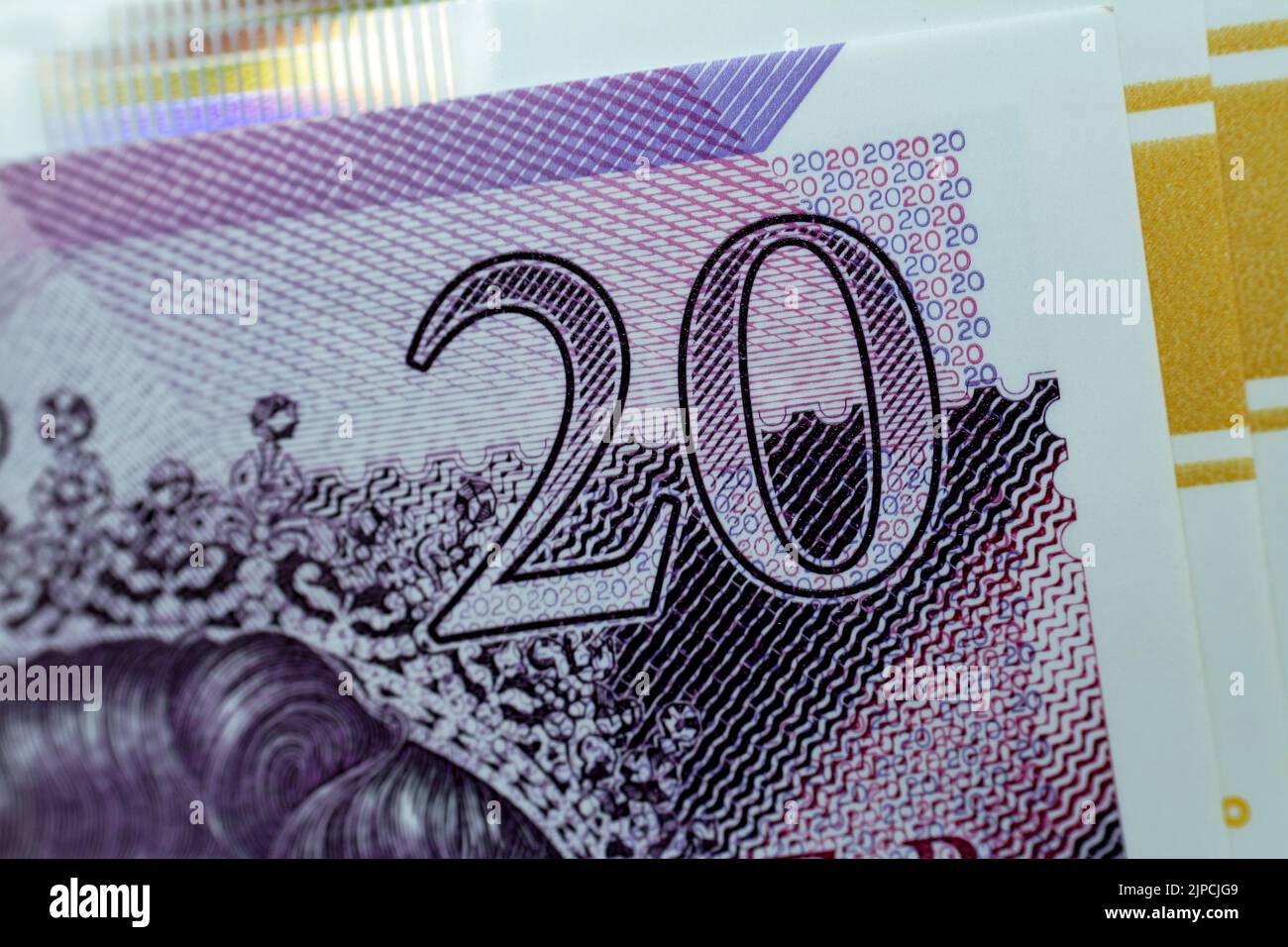 A closeup of £20 Twenty pounds cash money bill Sterling polymer ...