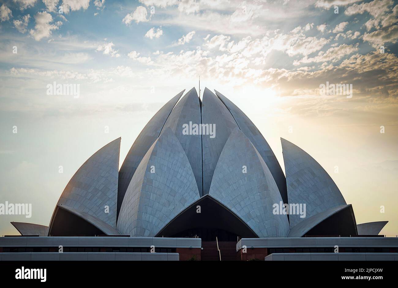 multi-faith temple. Lotus Temple at sunset, New Delhi, India. Sun goes ...