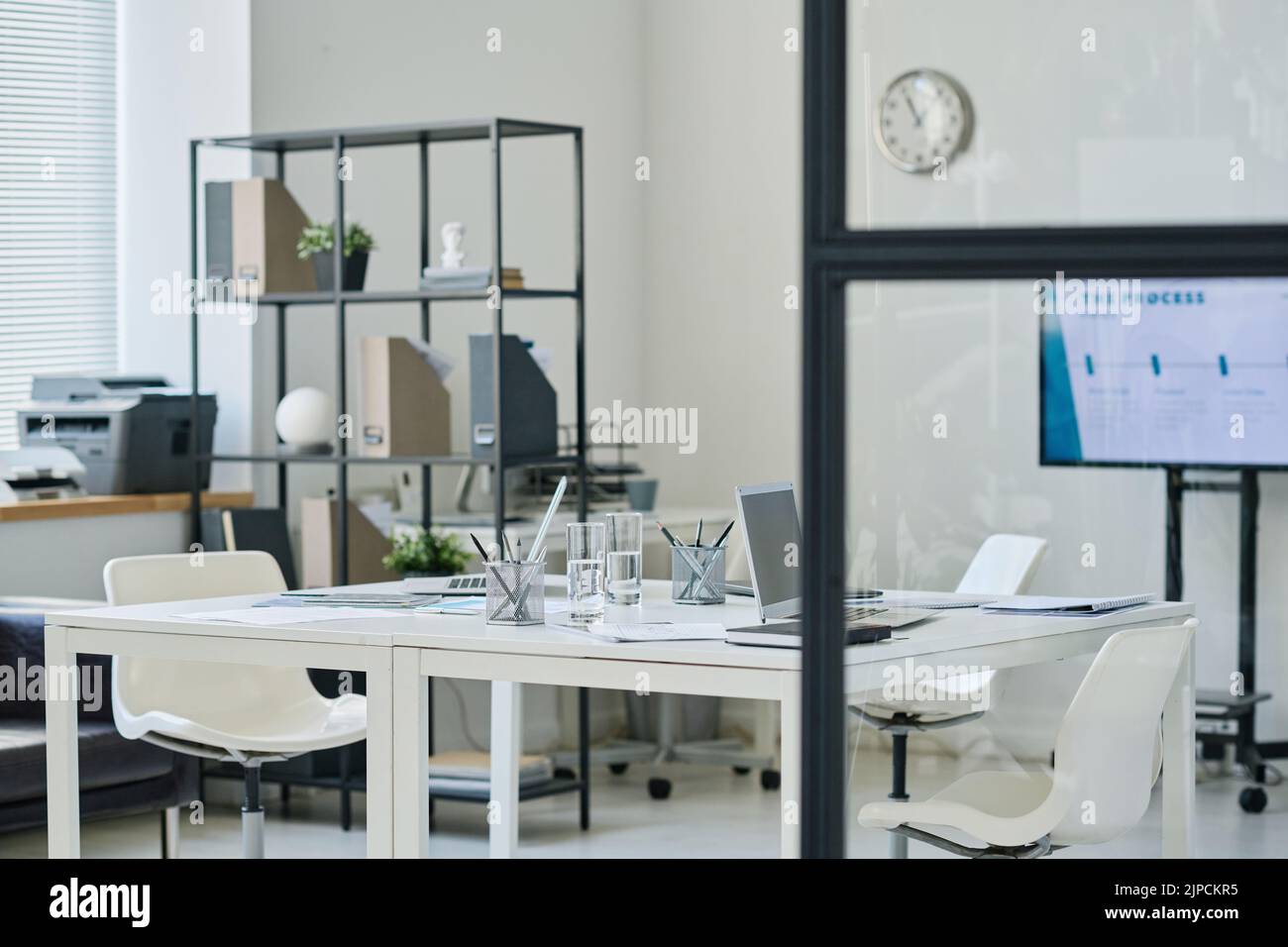 Horizontal image of modern board room with table for meeting and screen ...