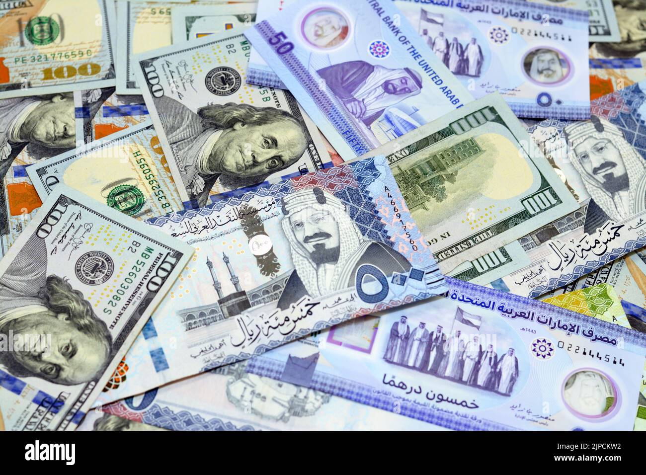 Pile of American dollar bills American cash money banknotes with Saudi ...