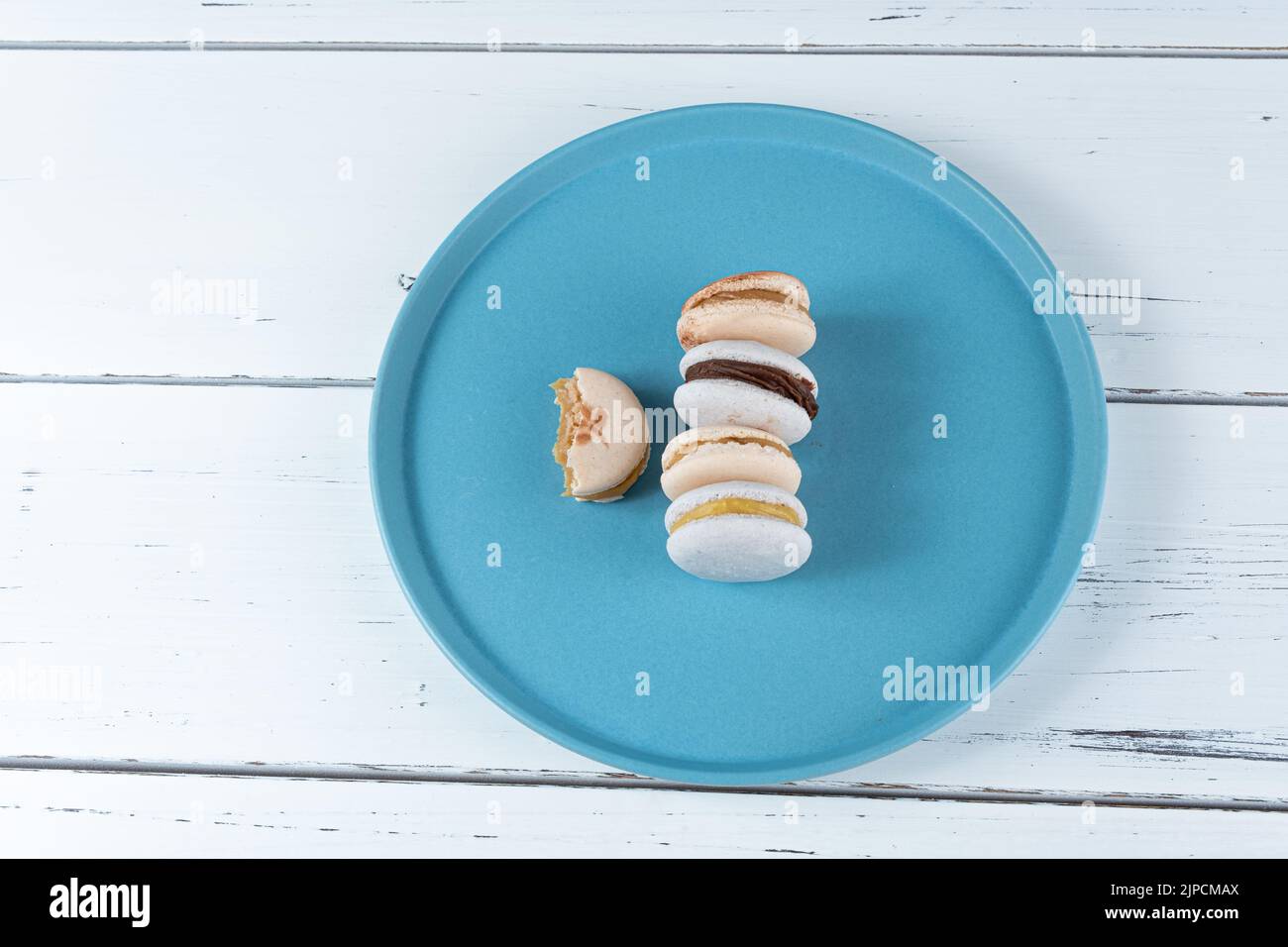 Stack of macarons with dulce de leche filling and chocolate ganache ...