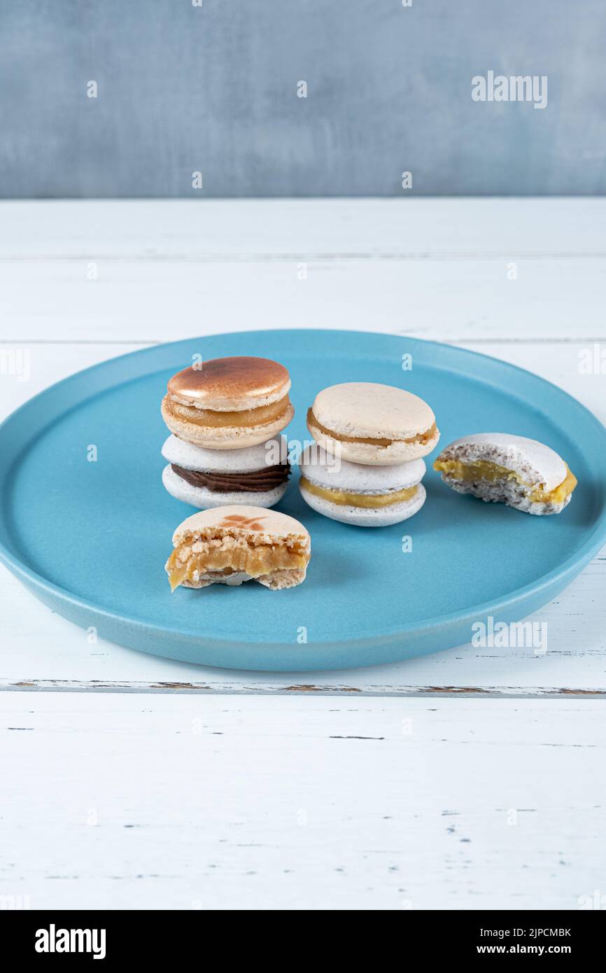 Stack of macarons filled with dulce de leche and chocolate ganache ...